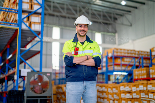 Professional warehouse worker stand with arm-crossed and smiling also ...