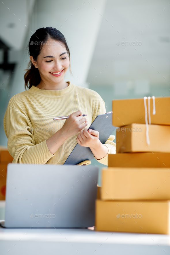 Asian SME business women use laptop computer checking customer order ...