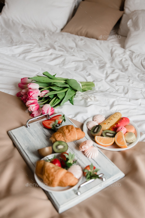Breakfast with a bouquet of flowers in bed at the hotel Stock Photo by ...