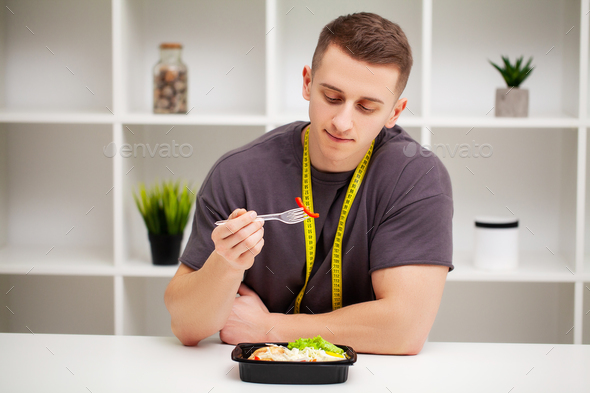 Man holding a box full of protein rich foods for sports nutrition Stock ...