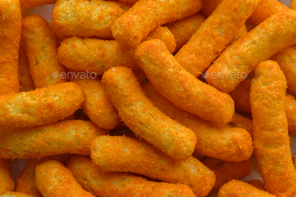 Spicy crunchy corn snack texture background. Stock Photo by Maliflower73