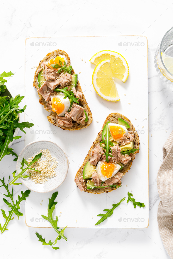 Tuna toast. Open sandwiches with whole grain bread, canned tuna, boiled ...