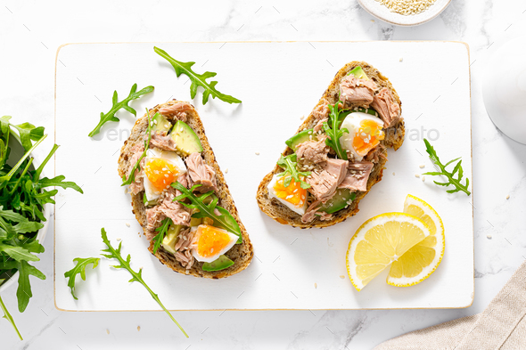 Tuna toast. Open sandwiches with whole grain bread, canned tuna, boiled ...
