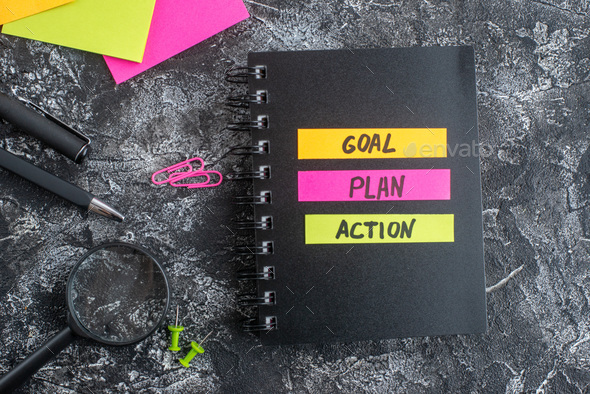 top view goal plan action notes on stickers on gray background college ...
