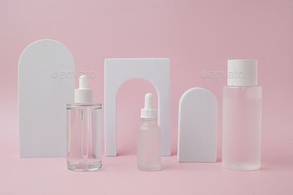 The set of skincare and cosmetic bottle display on the pink background ...