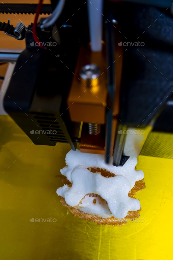 Modern 3D printer printing figure close-up macro 3d printer prints a ...