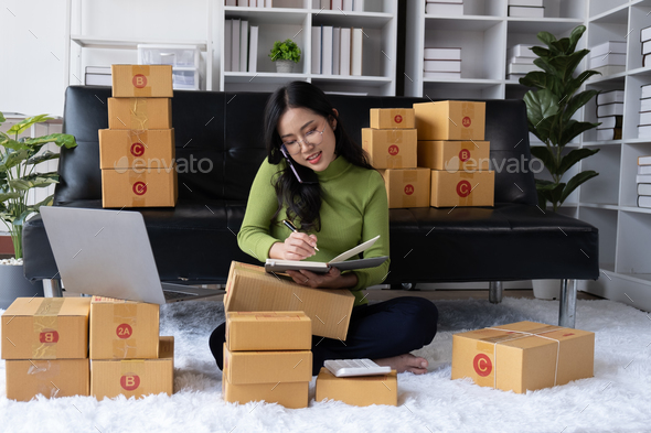 Small business SME concept. Young happy business owner working and ...