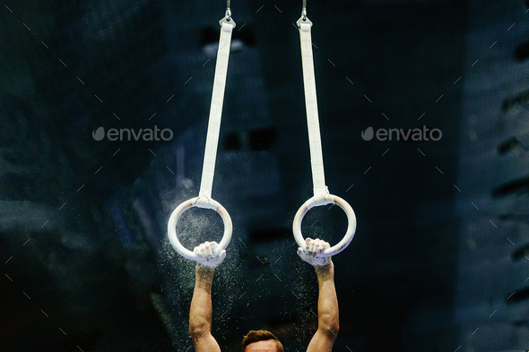 hand gymnast performing on ring frame competition artistic gymnastics ...