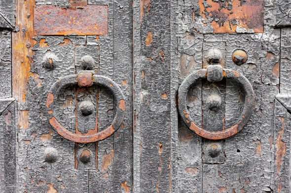 ancient gates with metal round handles, old paint texture restoration ...