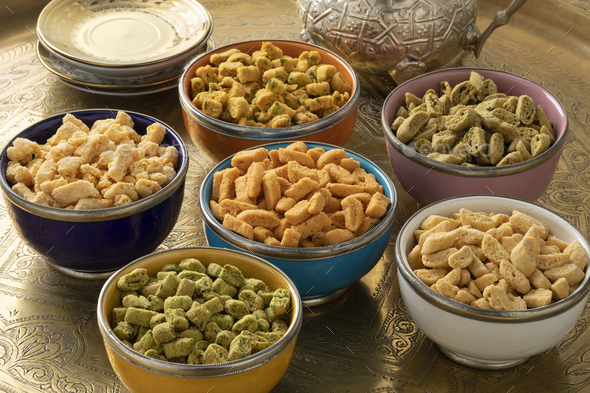 Colorful bowlsl with a variation of miniature shortbread cookies ...