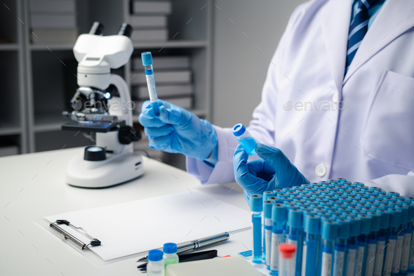 Close up view of scientist researcher testing laboratory experiment ...