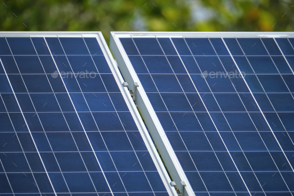 Solar photovoltaic panels mounted on stand-alone frame on backyard ...