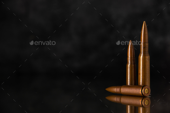 brown bullets on a dark background shooting gun tank death war Stock ...