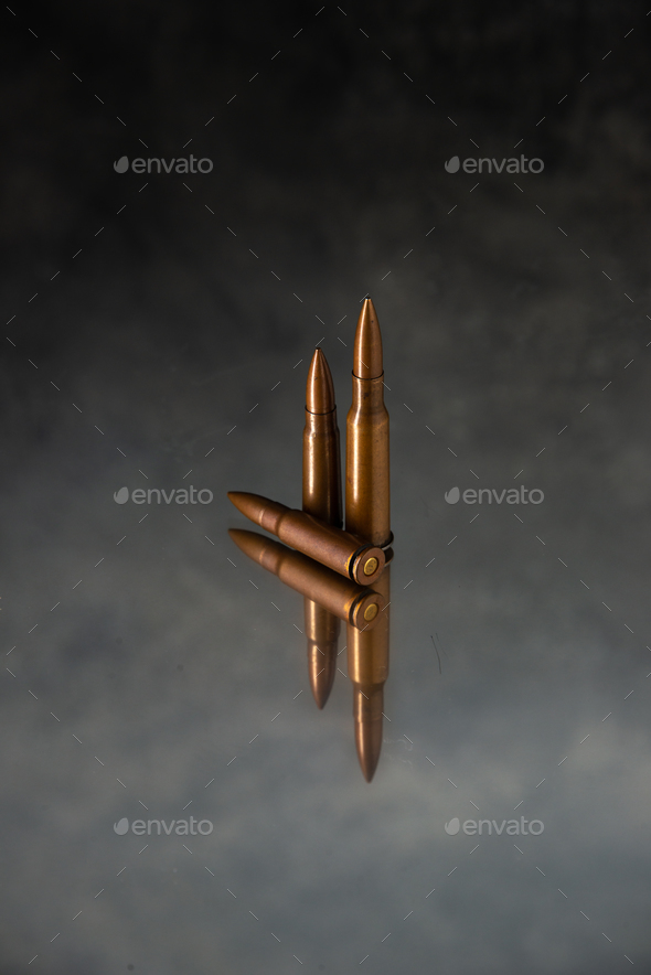 brown bullets on dark desk shooting gun tank death war Stock Photo by ...