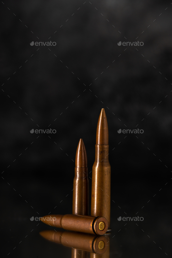 brown bullets on the dark background shooting gun tank death war Stock ...