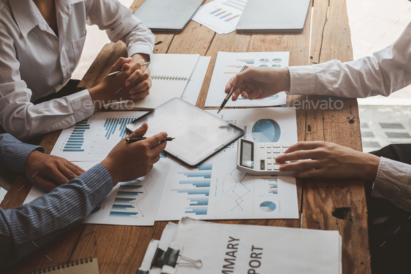 Business People Meeting using chart graph calculator, laptop computer ...