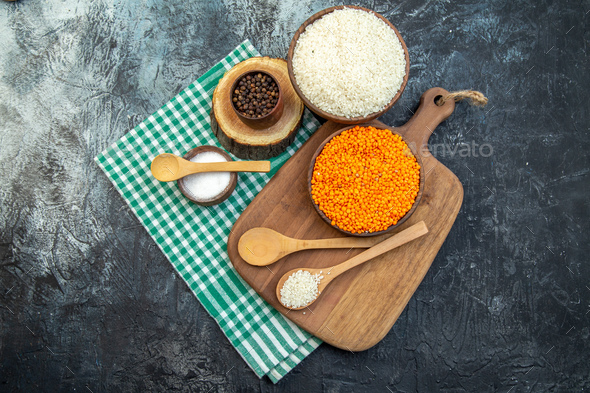 top view raw rice with orange lentils on dark background food seed ...