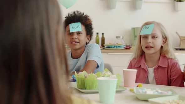 Kids Playing Forehead Detective, Stock Footage | VideoHive