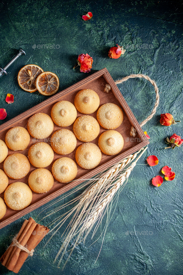 top view tasty biscuits inside wooden box on dark blue background sugar ...