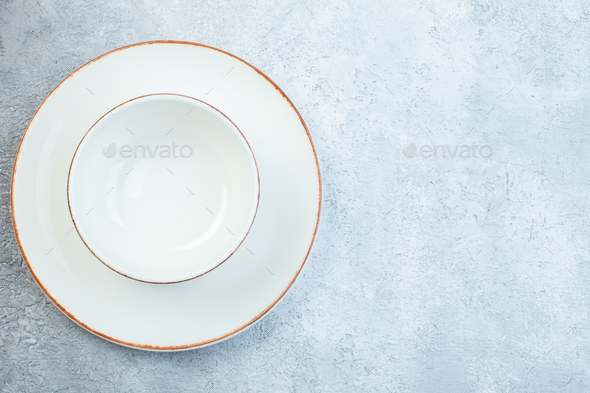 Elegant dinnerware set on gray background with distressed surface with ...
