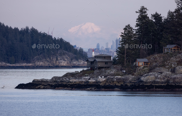 Cabins on Passage Island with Downtown City Buildings and Lighthouse ...