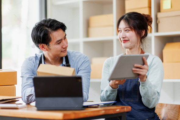 Startup small business SME. Two Young Asian business entrepreneurs ...