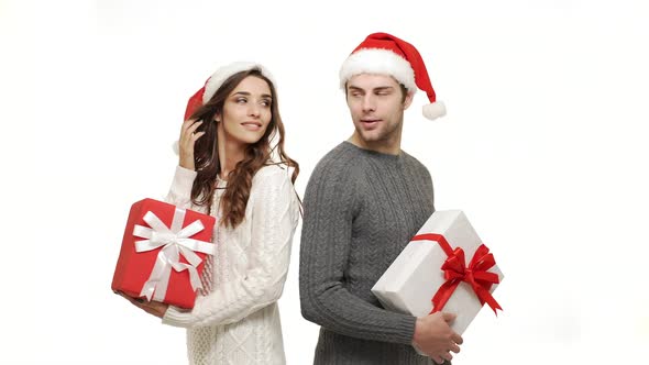 Young Couple on Sweater Turning Around Surprise Each Other with Present ...