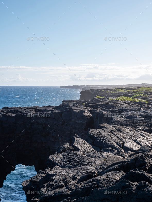 Vertical high-angle of Hawaii volcano national park with black cliffs ...