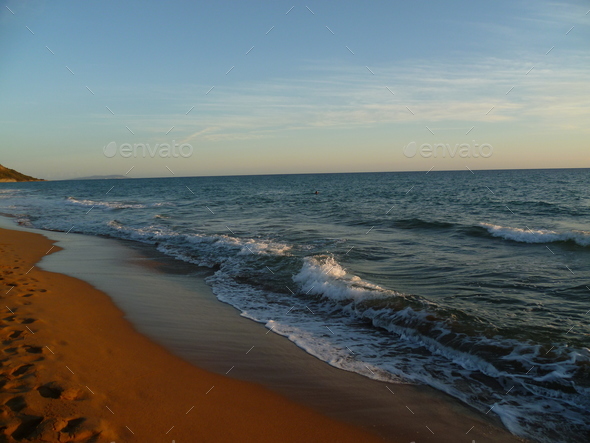 Beautiful scenery of a water of sea doing splash with soft sands on the ...