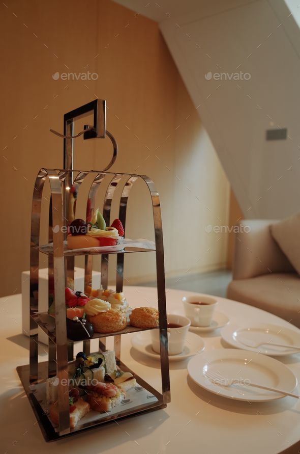 Vertical shot of a setting for an afternoon tea Stock Photo by wirestock