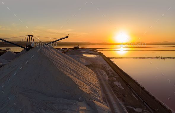 Heap of salt at Las Salinas salt factory in Torrevieja, Spain on orange ...