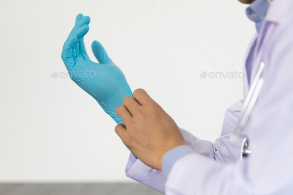 Doctor wearing medical gloves in the doctor's office. Stock Photo by ...