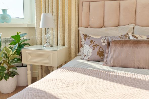 Classic bedroom interior in light ivory colors, in warm sunlight Stock ...