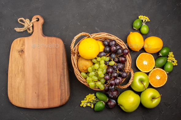 top view fresh fruits composition ripe and mellow fruits on dark ...