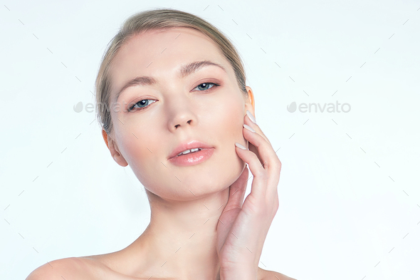 face of beautiful woman pointing at her eye area. perfect skin Stock ...