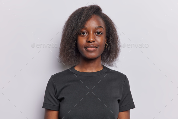 Portrait of lovely teenage girl with dark skin short afro hair poses ...