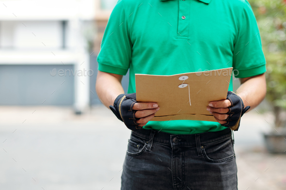 Courier Delivering Document Stock Photo by DragonImages | PhotoDune