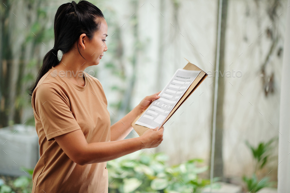 Woman Receiving Important Document Stock Photo by DragonImages | PhotoDune