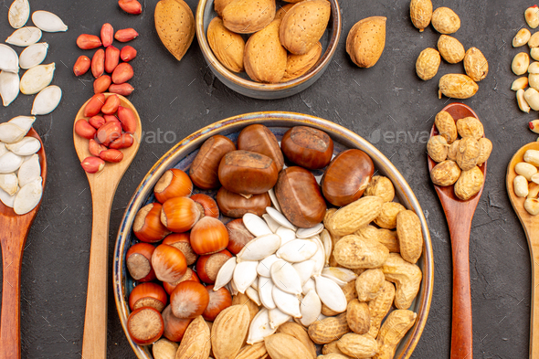 top close view nut composition different nuts on dark desk walnut snack ...