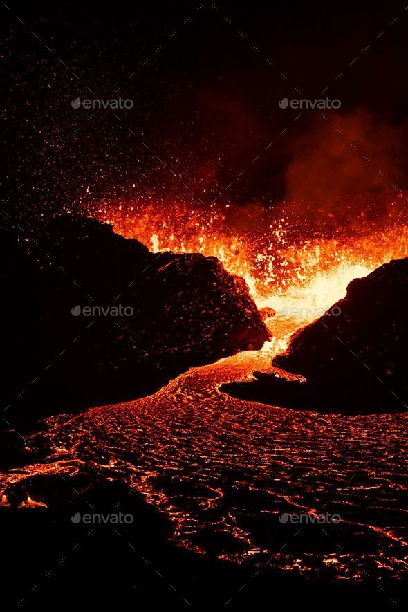 Vertical shot of lava flowing over rocky surface during 2022 Meradalir ...