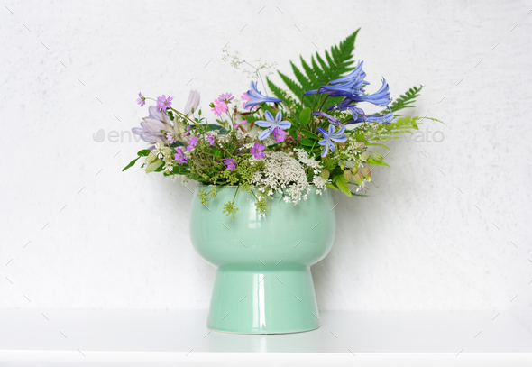 Vase with beautiful simple flowers Stock Photo by annakhomulo | PhotoDune