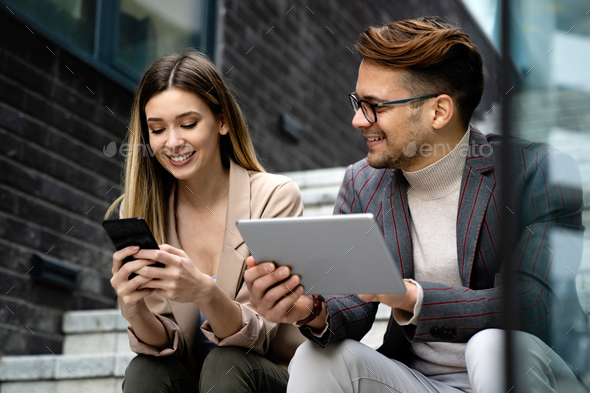 Successful business people, designer enjoying work together. Business ...