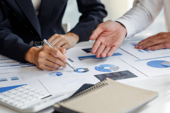 Business People Meeting using chart graph calculator, laptop computer ...