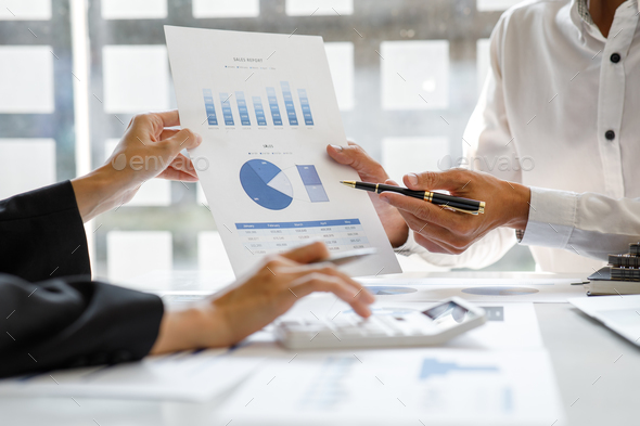 Business People Meeting using chart graph calculator, laptop computer ...