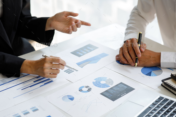 Business People Meeting using chart graph calculator, laptop computer ...