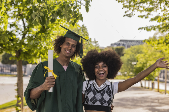 A happy graduating student with her girlfriend after the graduation ...
