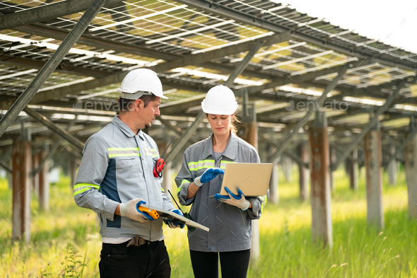 photovoltaic panel, Engineer with energy measurement tool photovoltaic ...