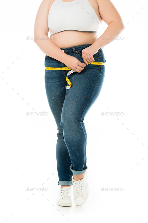 cropped view of overweight woman measuring hips isolated on white Stock ...