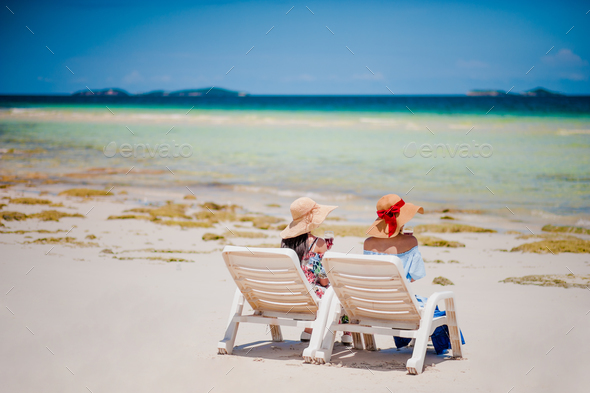 Friends at the Beach. Beautiful girls on sunny tropical beach . Stock ...