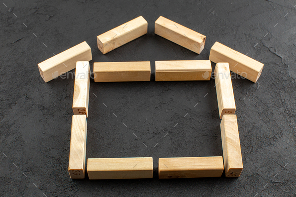 bottom view house shaped wood blocks on black background Stock Photo by ...